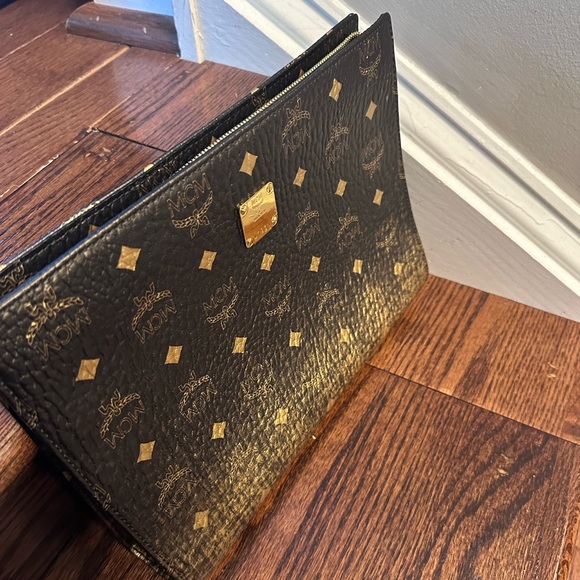 MCM | Bags | Mcm Black Gold Clutch | Poshmark